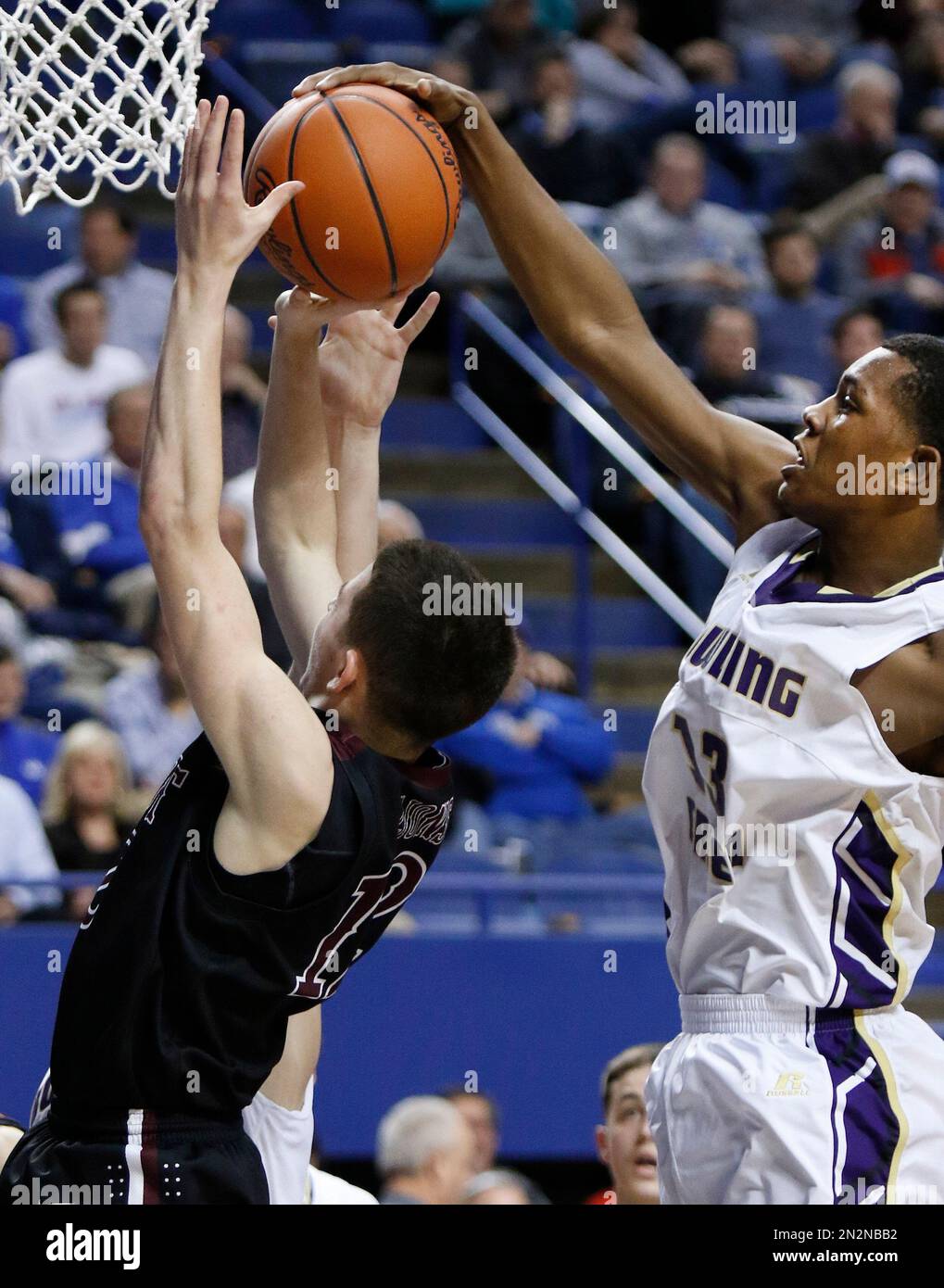 Bowling Green's Kyran Jones, right, blocks a shot by Elliott County's ...