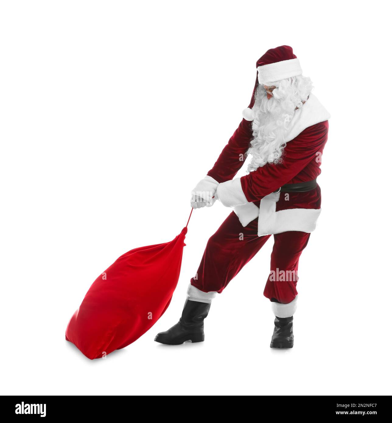 Santa Claus pulling red sack on white background Stock Photo - Alamy