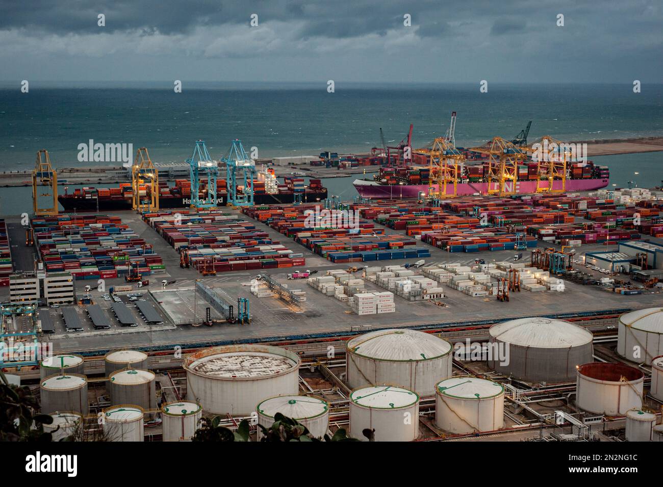 Cargo ships loading and unloading containers at the port of Barcelona ...