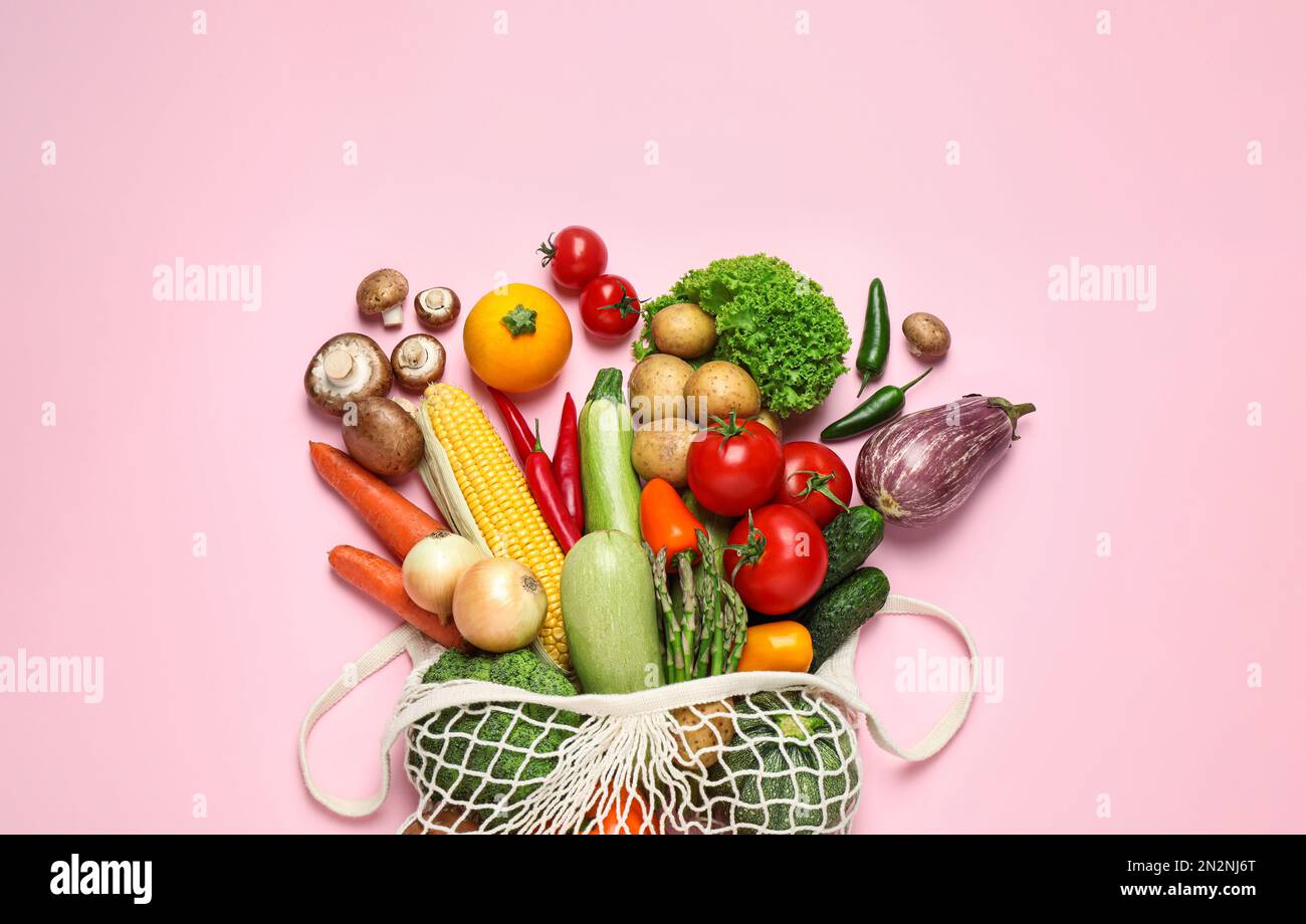 Different fresh vegetables on pink background, flat lay Stock Photo - Alamy