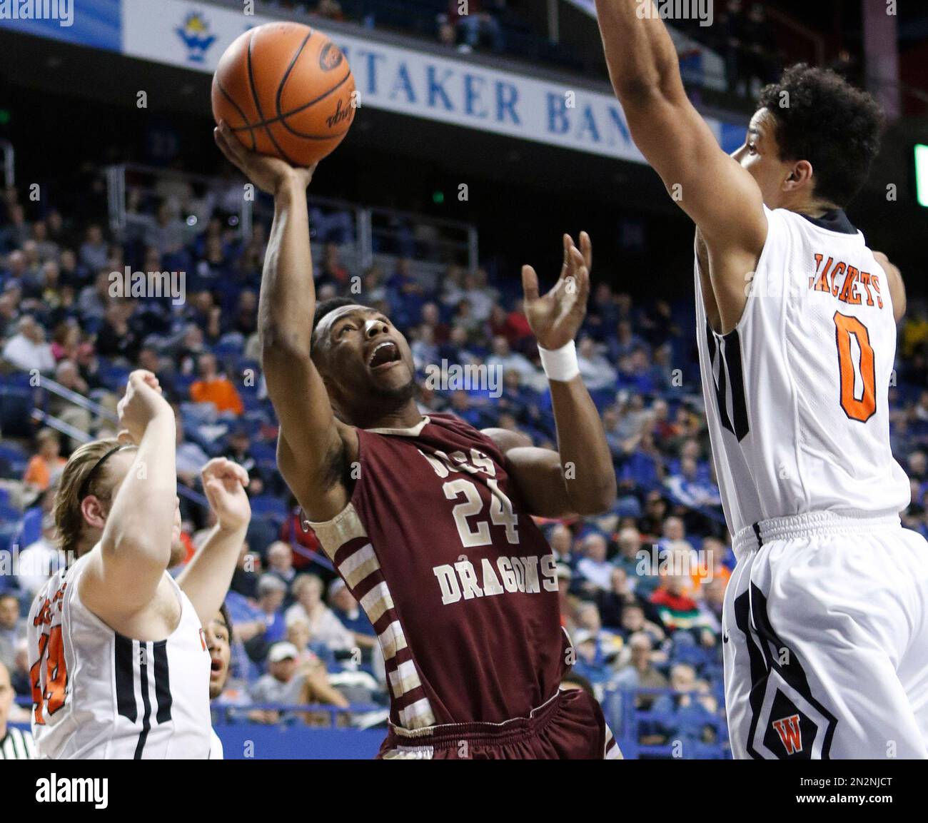 Doss' Terrell Gray, center, shoots between Williamsburg's Ethan Wilson ...