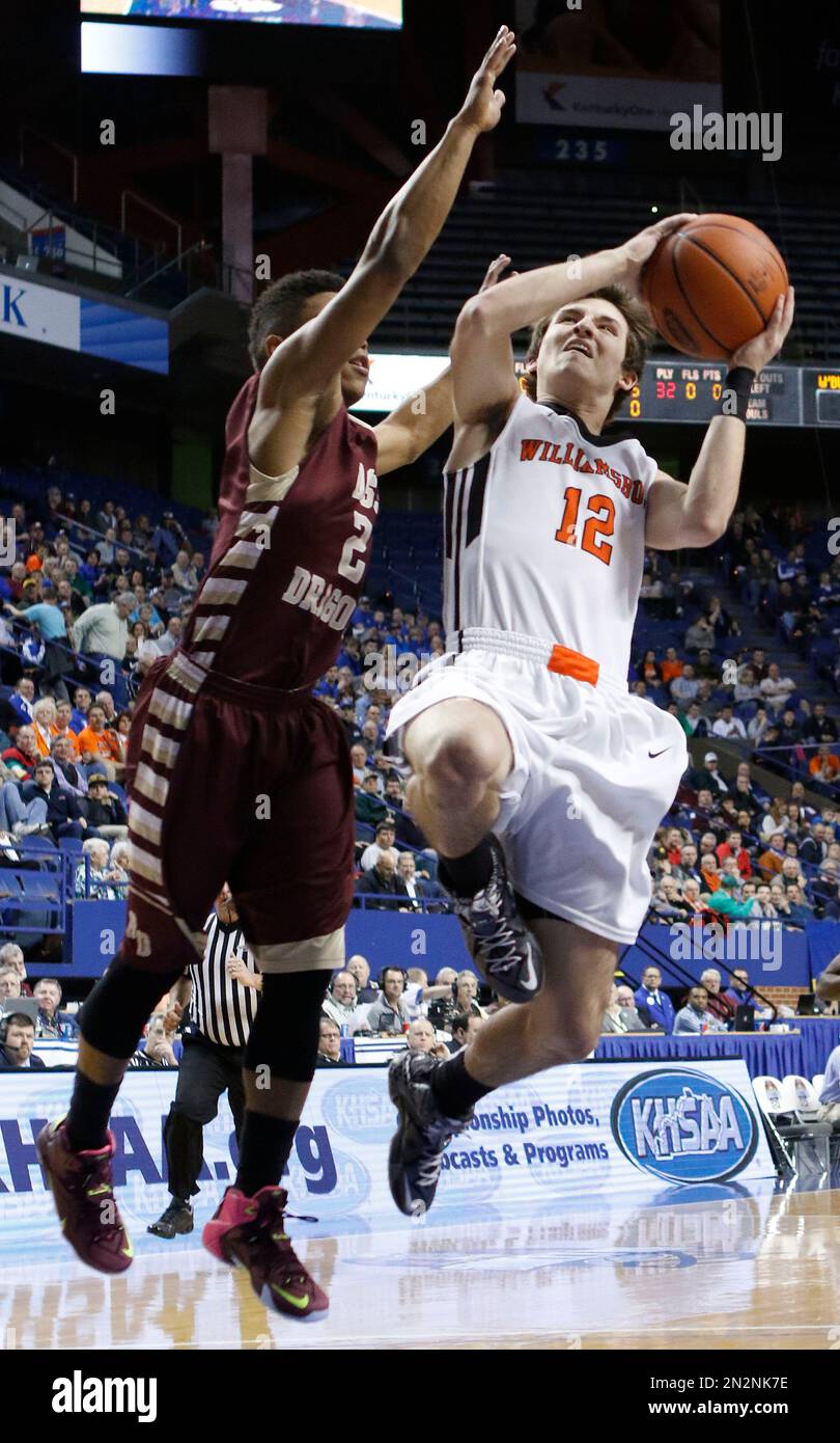 Williamsburg's Corey Shelton (12) shoots under pressure from Doss ...