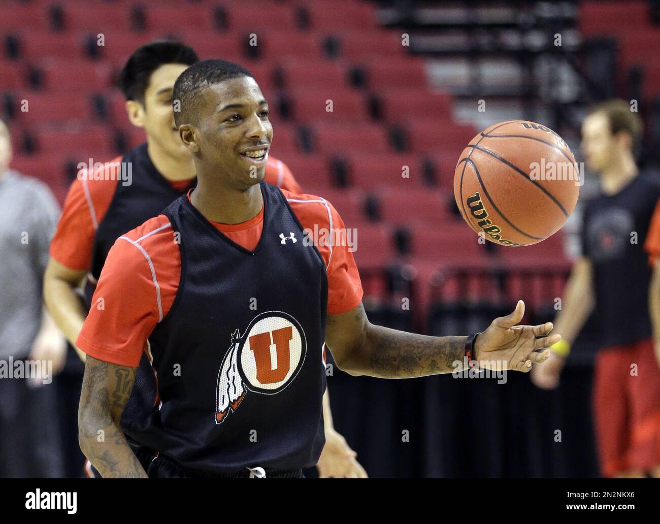 Utah guard Delon Wright flips the ball as he runs downcourt during ...