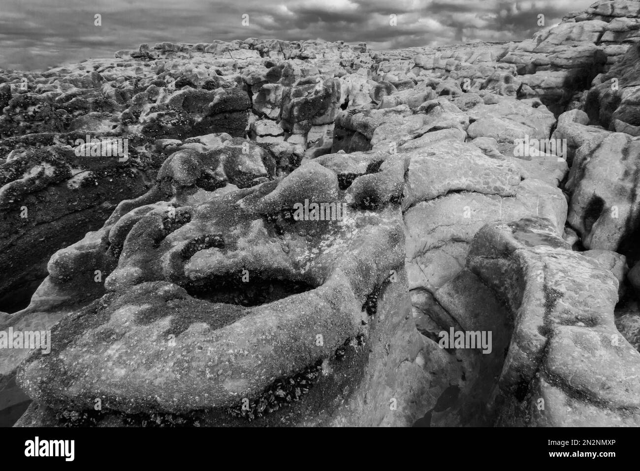 Rock formations prehistoric landscape Black and White Stock Photos ...