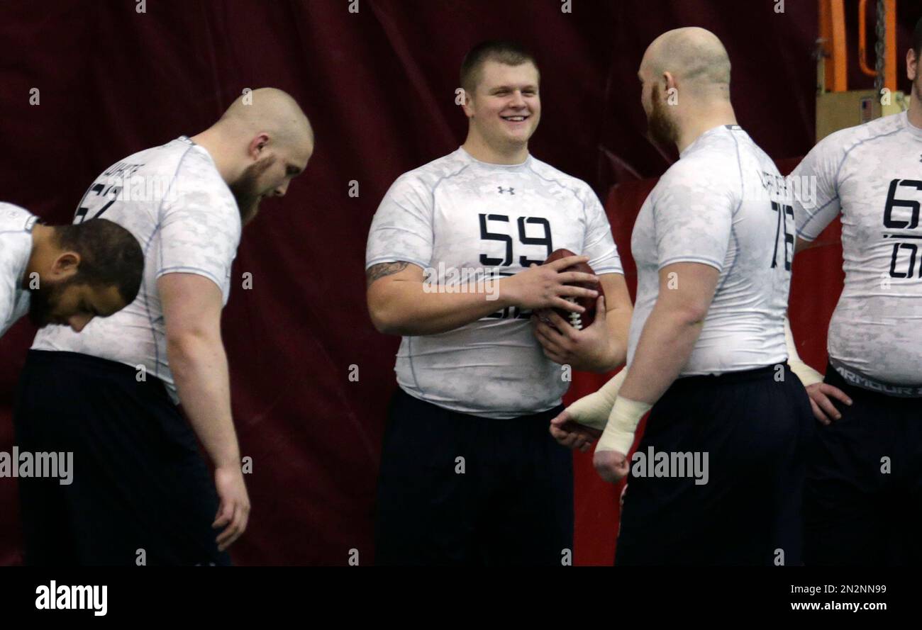 Boston College center Andy Gallik (59) jokes with teammates during an ...