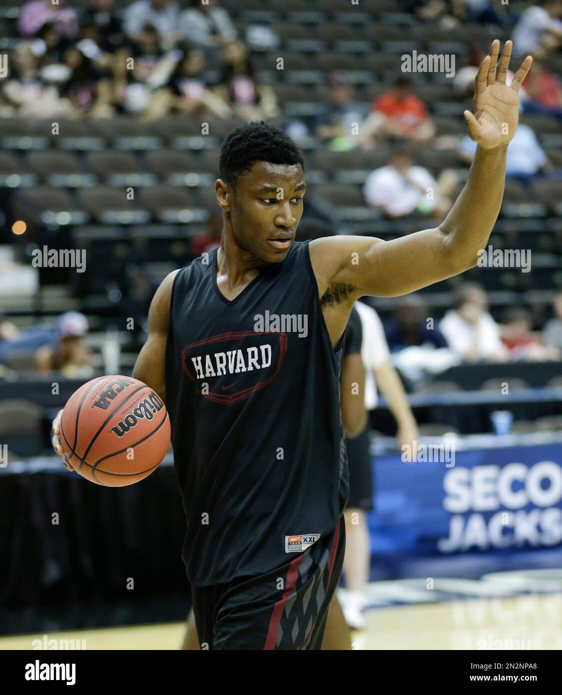 Harvard's Zena Edosomwan waves to a teammate during practice for an ...