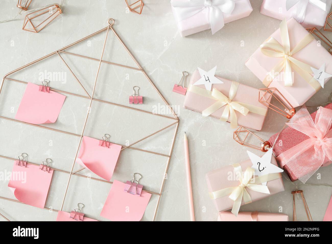 Flat lay composition with gift boxes and paper notes on grey marble ...