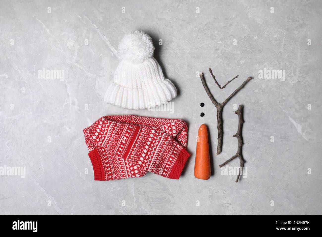 Set of elements for snowman on light grey marble background, flat lay ...