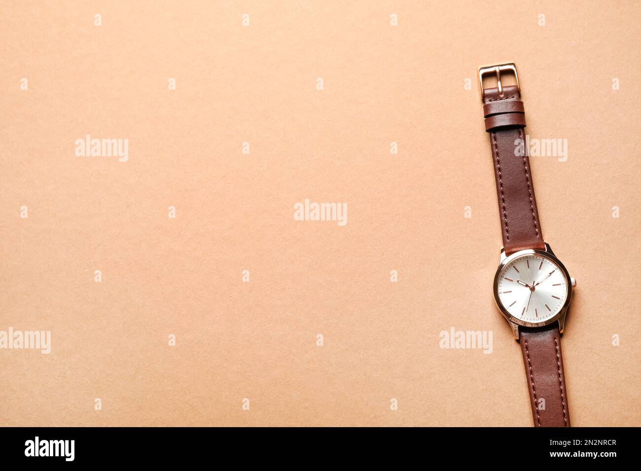 Luxury wrist watch on beige background, top view. Space for text Stock ...