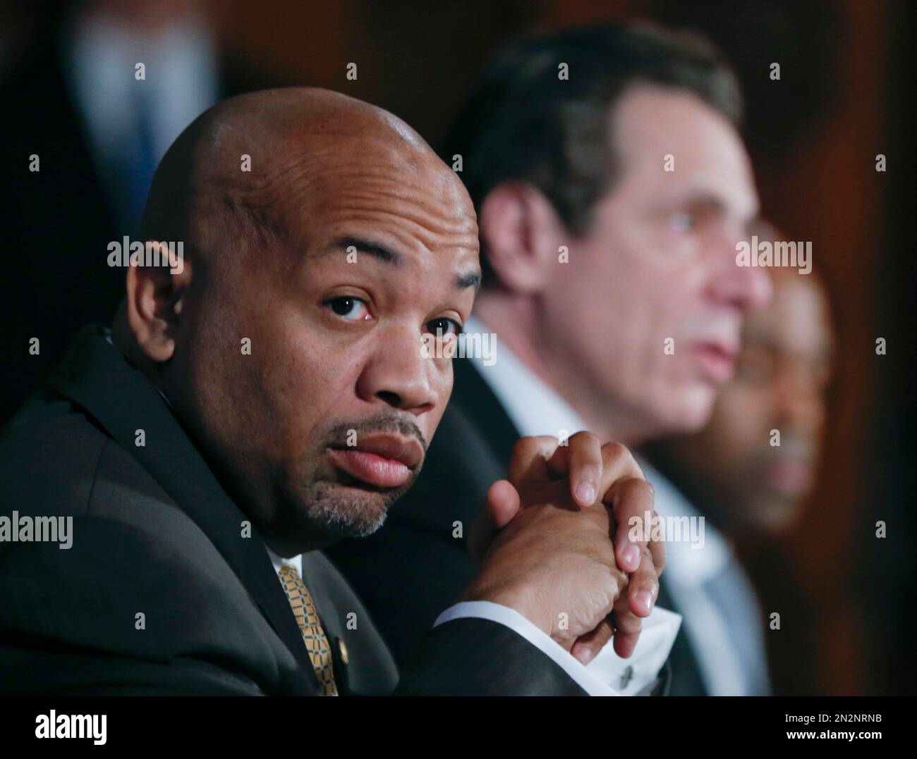 Assembly Speaker Carl Heastie, D-Bronx, listens as New York Gov. Andrew ...