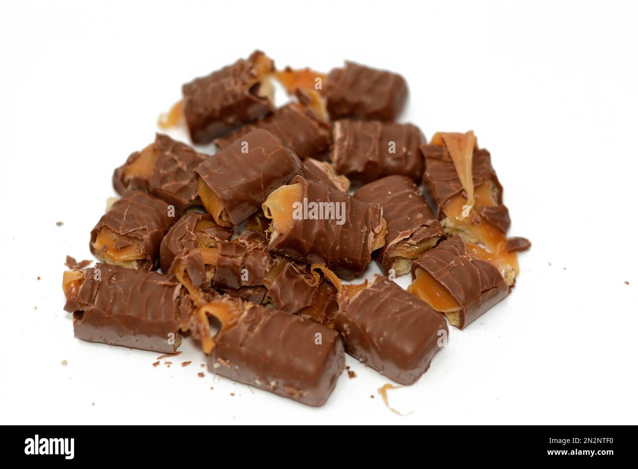small pieces of chocolate bars sticks filled with biscuits, caramel and ...