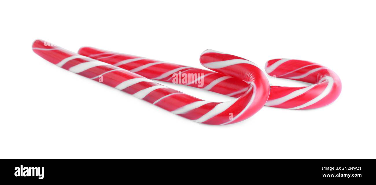 Sweet Christmas candy canes on white background Stock Photo - Alamy