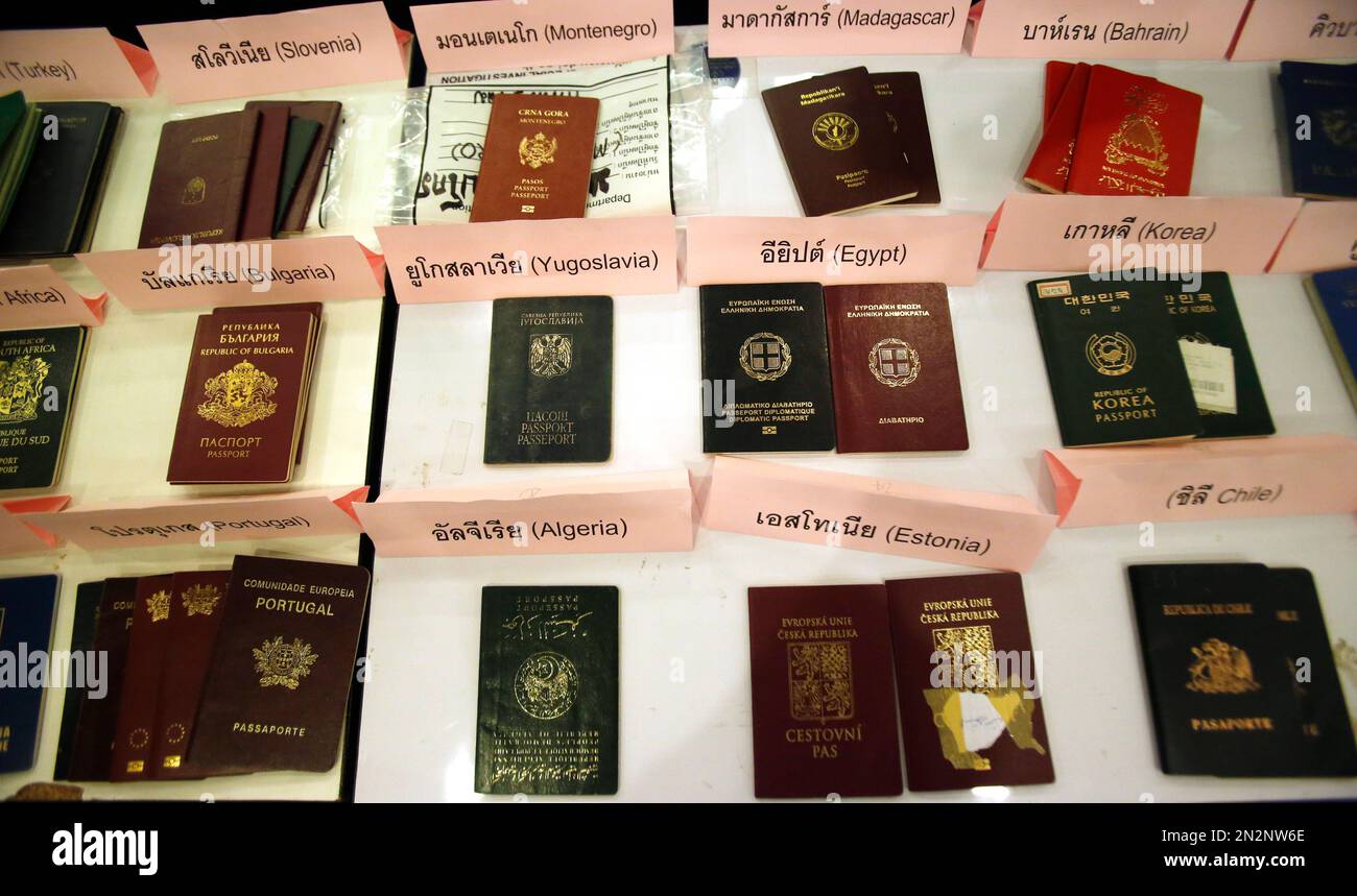 Department of Special Investigation officers display stolen passports ...