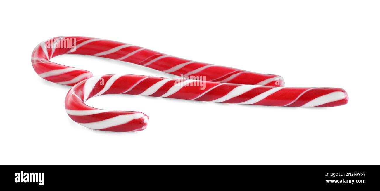 Sweet Christmas candy canes on white background Stock Photo - Alamy