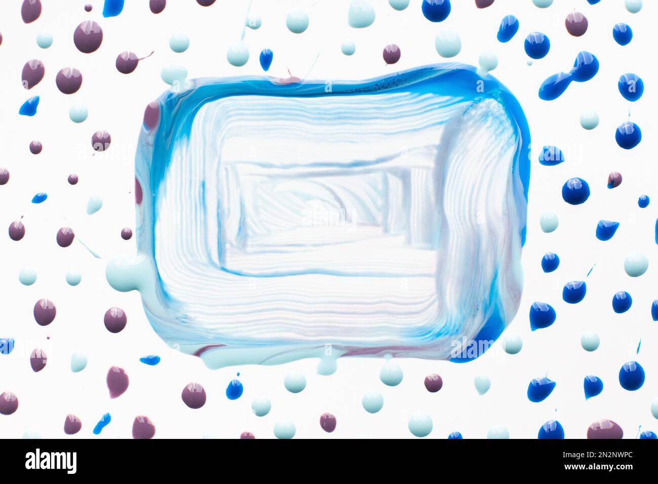 Blue stains on paint splatter background Stock Photo - Alamy
