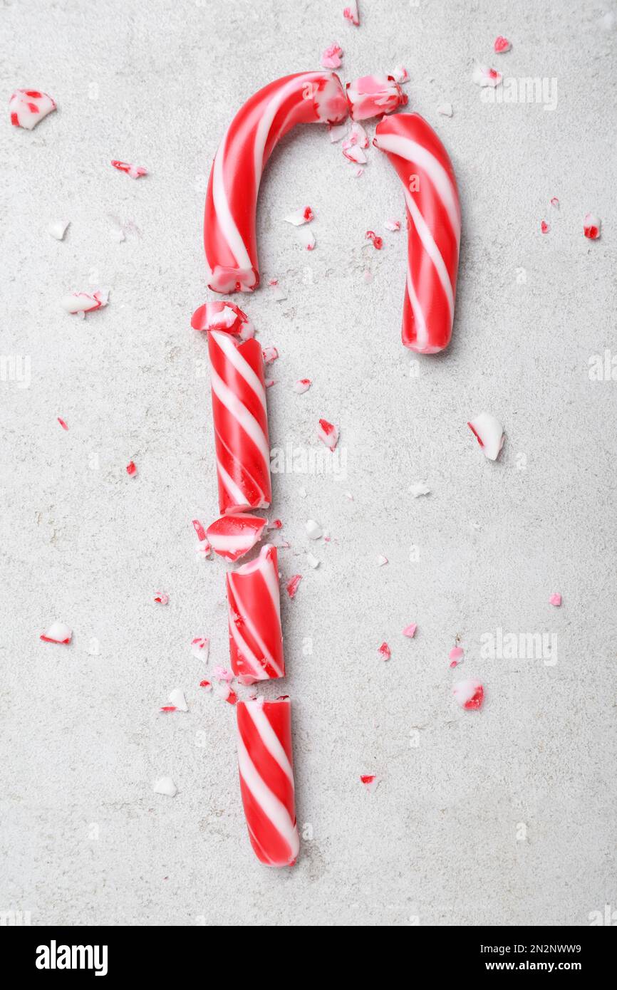 Crushed Christmas candy cane on grey background, flat lay Stock Photo ...