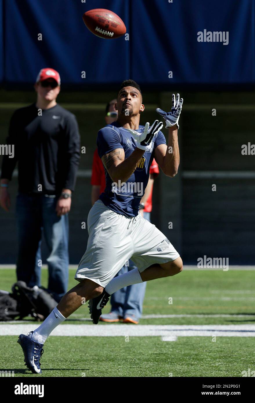 California wide receiver Chris Harper catches a pass in front of scouts ...
