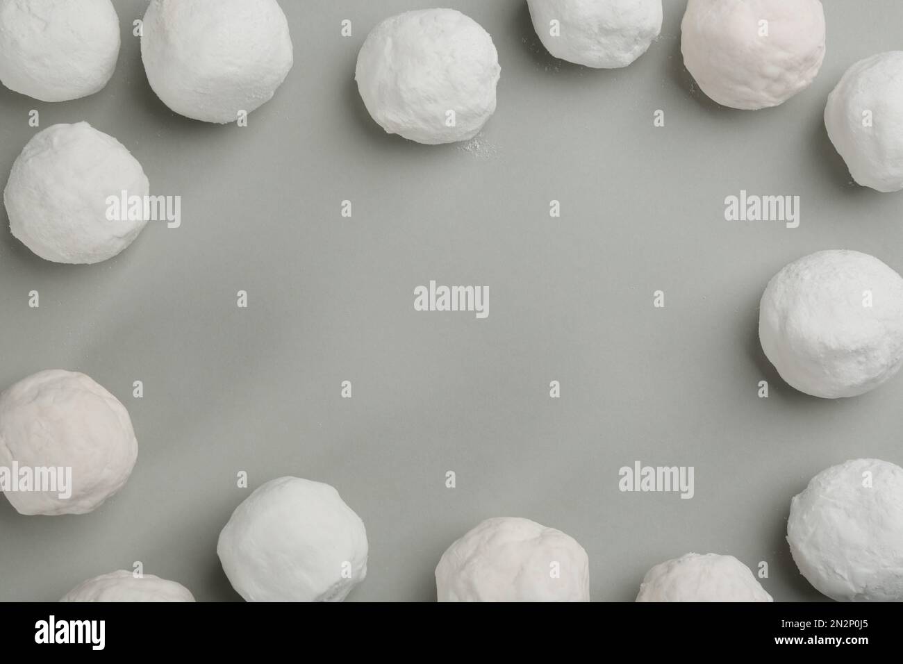 Frame of snowballs on grey background, flat lay. Space for text Stock ...