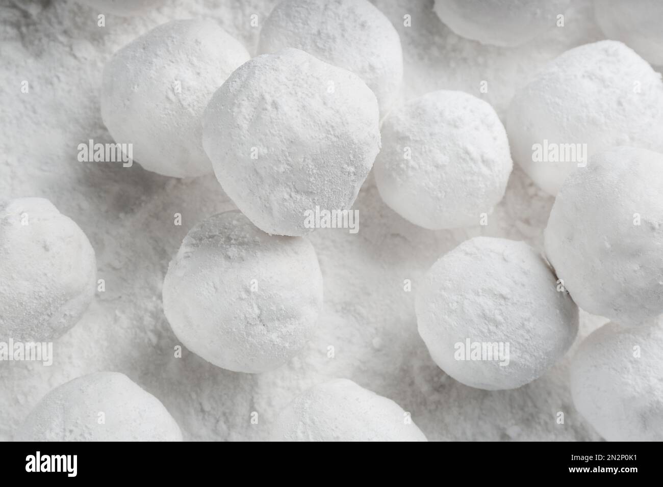 Round snowballs on snow, flat lay. Winter activities Stock Photo - Alamy