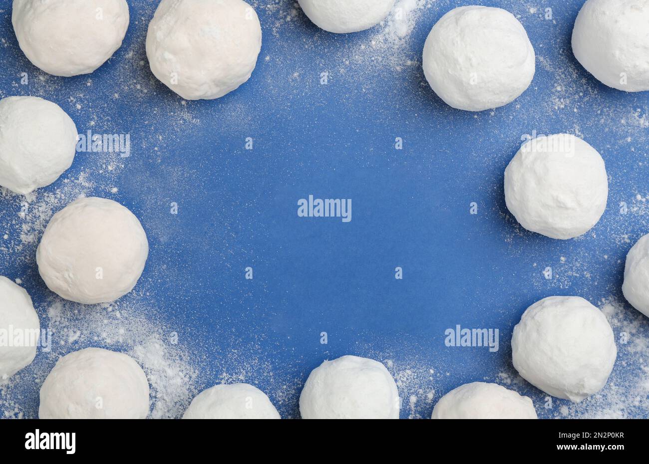 Frame of snowballs on blue background, flat lay. Space for text Stock ...