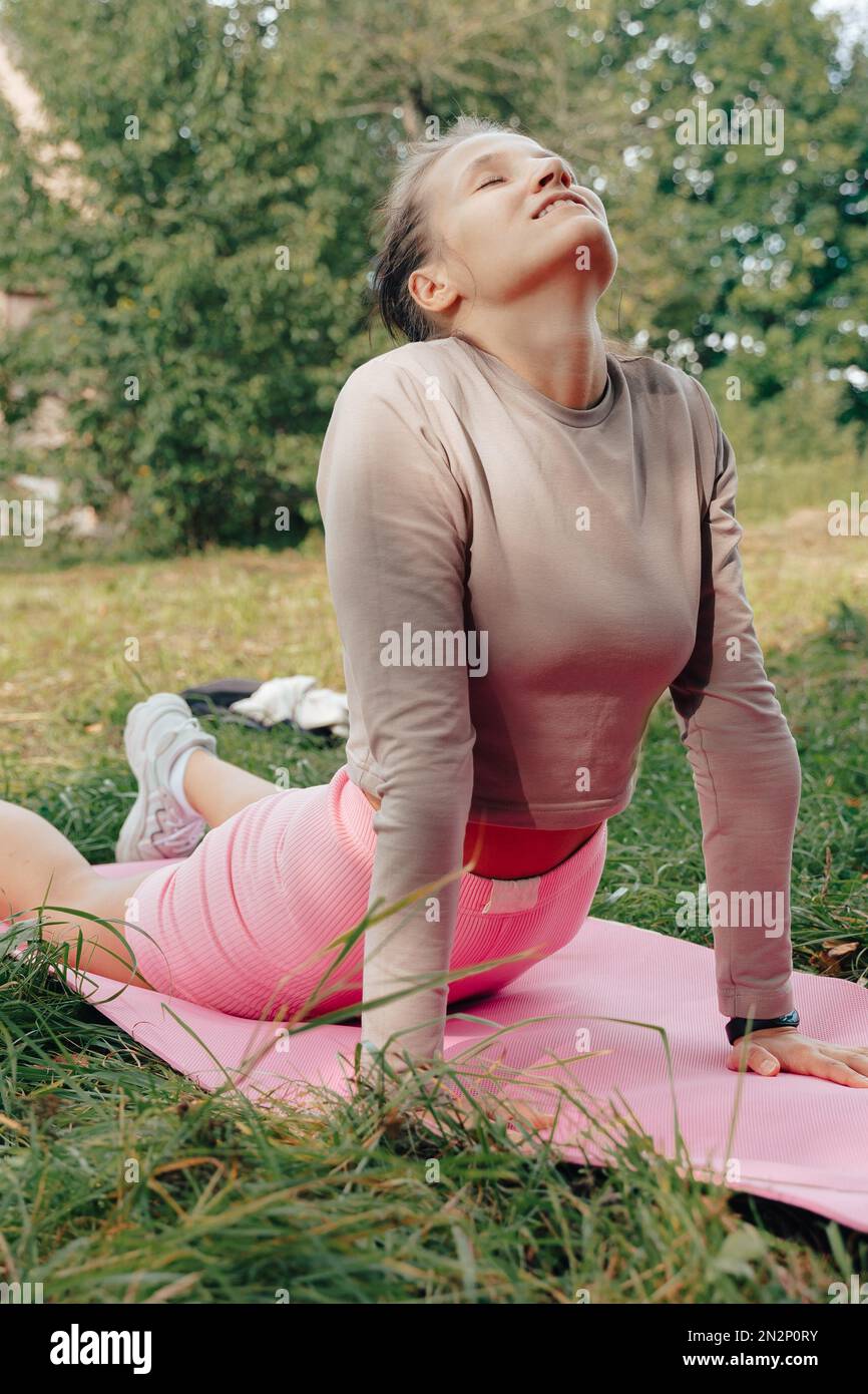 Millennial Yogi woman breathing doing Padmasana exercise practicing ...