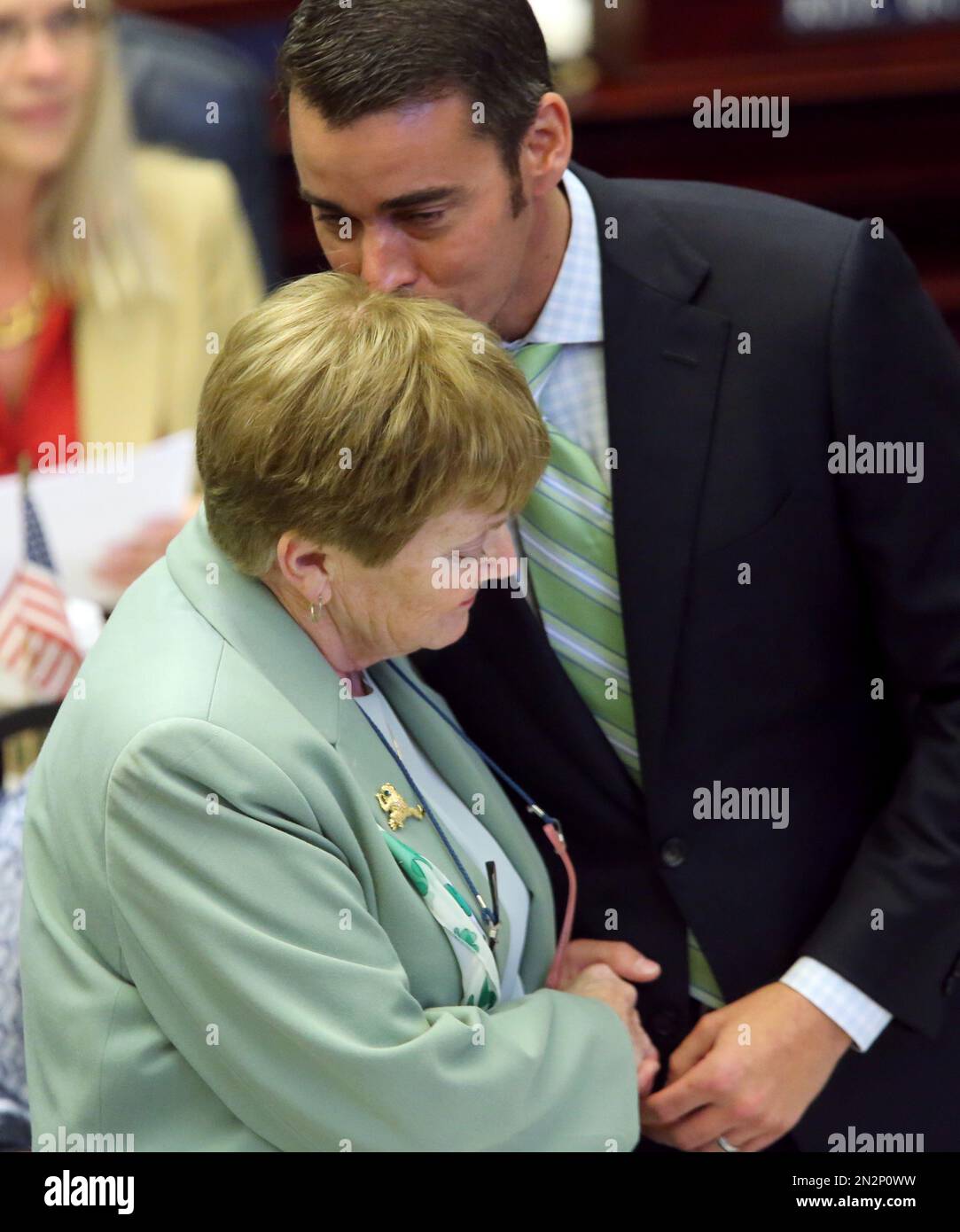 Rep. Marlene O'Toole, R-Lady Lake, gets a kiss on the head and a hand ...