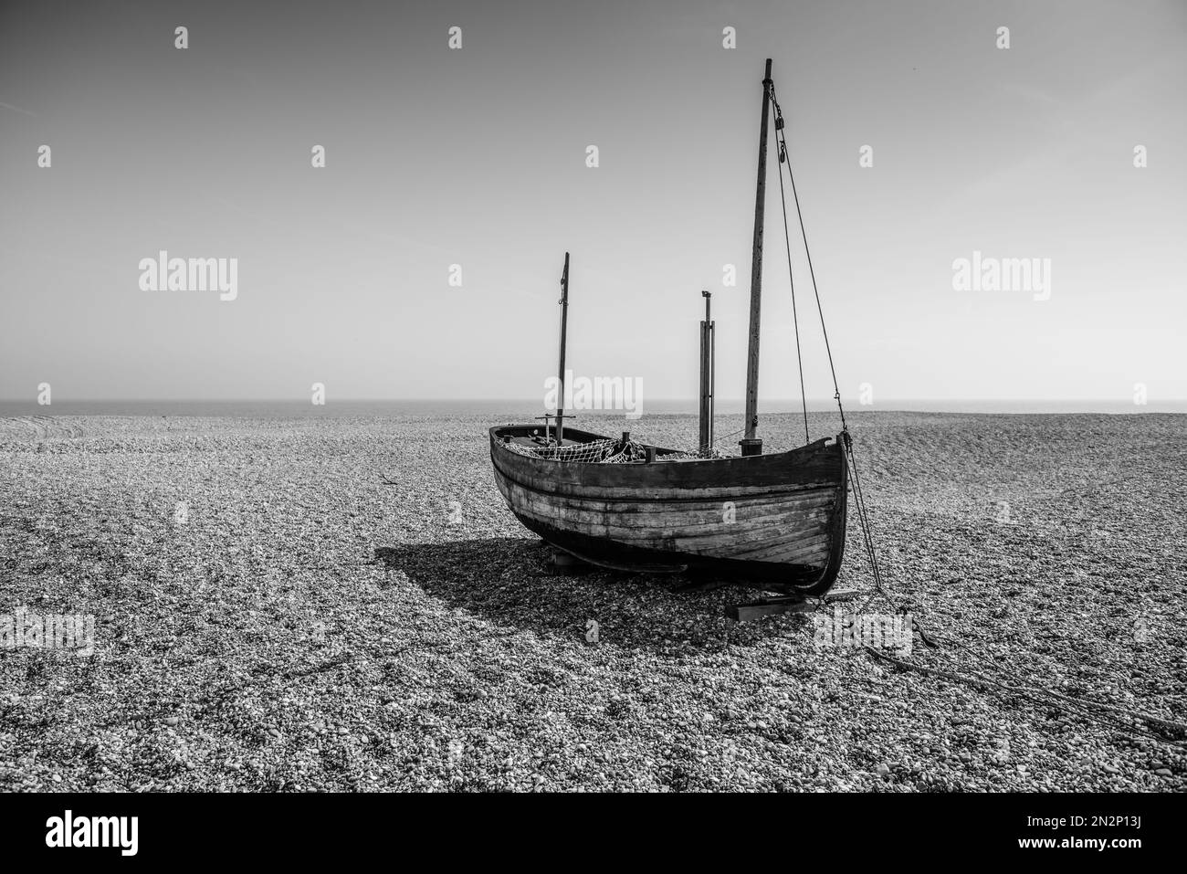 Beautiful old wooden fishing boats, abandoned on the shale beach at ...