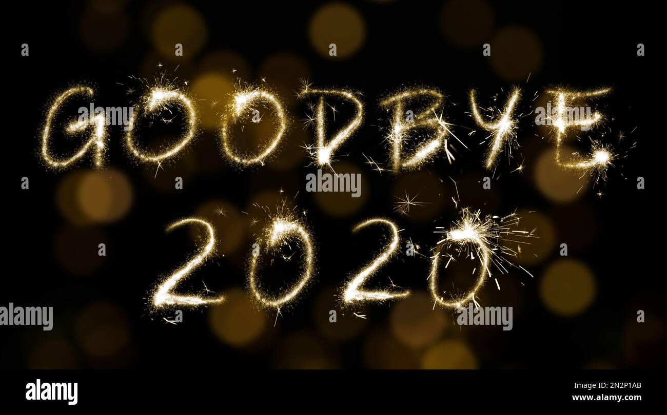 Goodbye 2020. Bright text made of sparkler on black background with ...