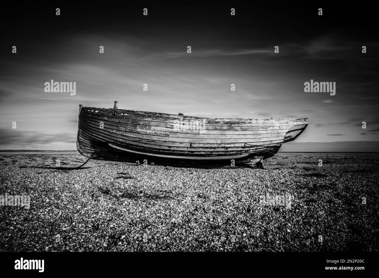 Beautiful old wooden fishing boats, abandoned on the shale beach at ...