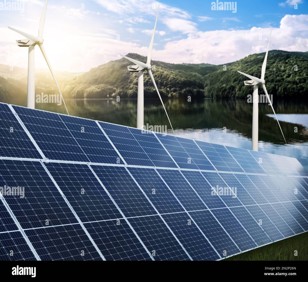 Alternative energy sources. Wind turbines installed in water near bank ...