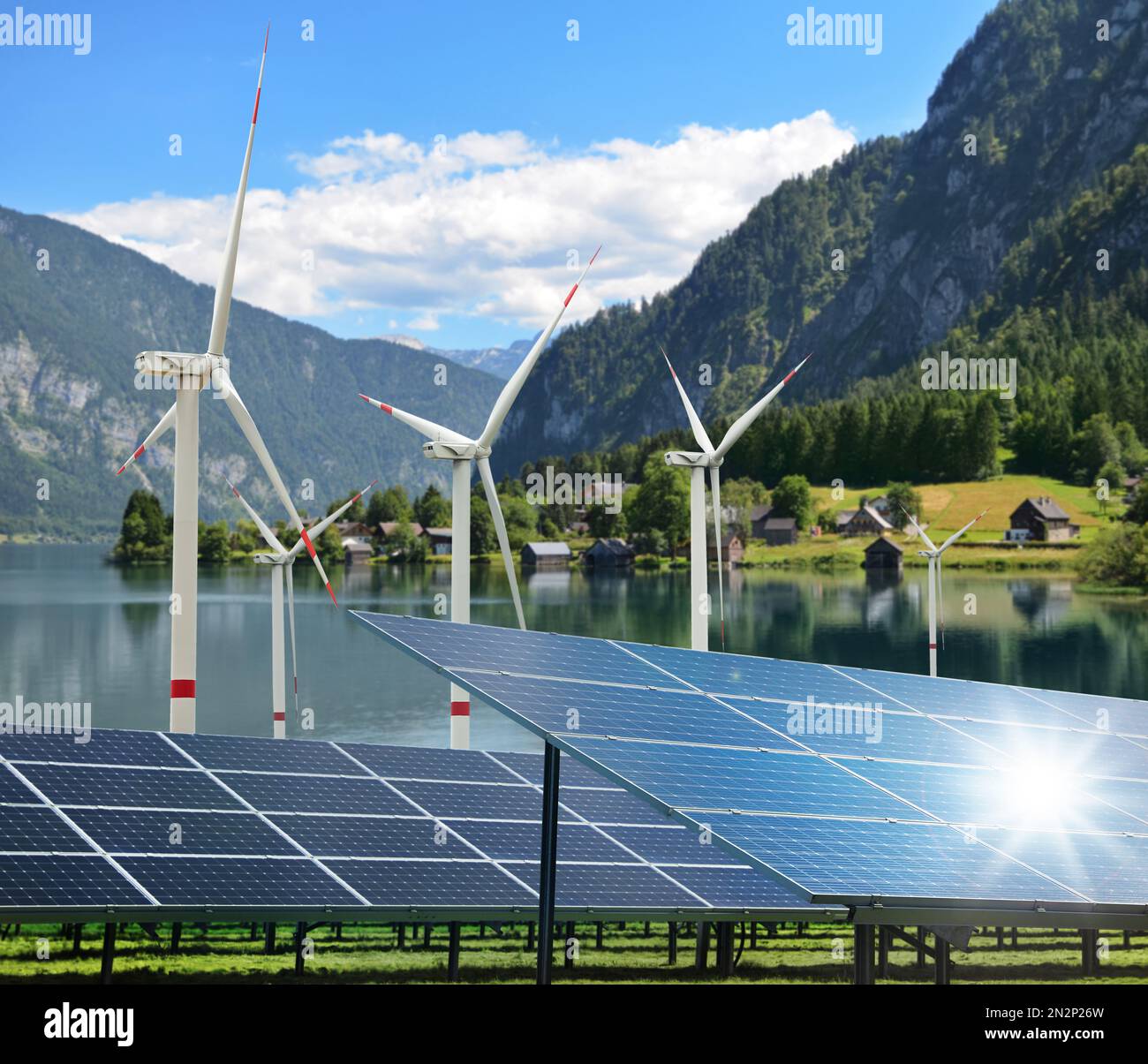 Alternative energy sources. Wind turbines installed in water near bank ...