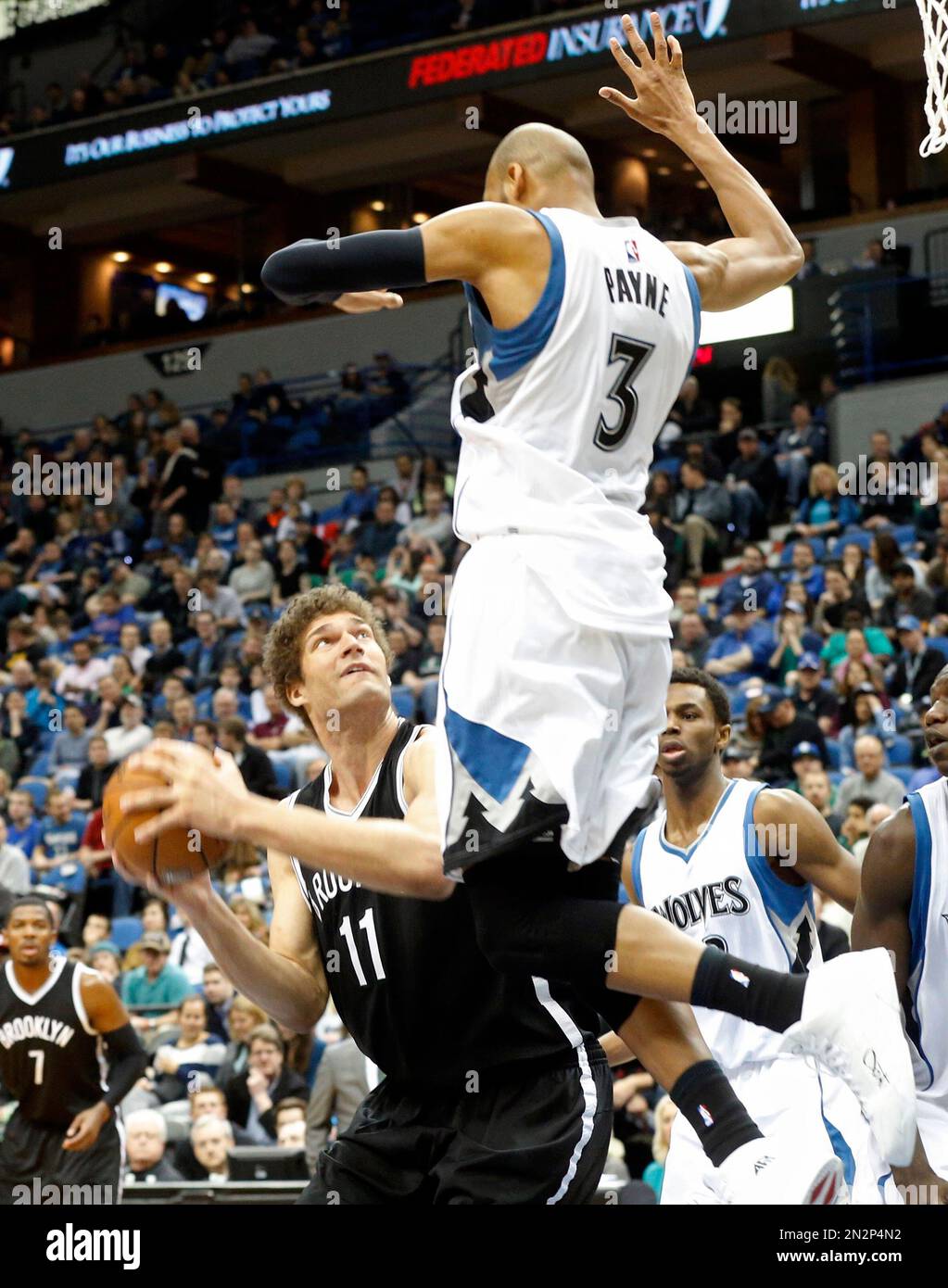 Brooklyn Nets’ Brook Lopez, left, looks to shoot as Minnesota ...