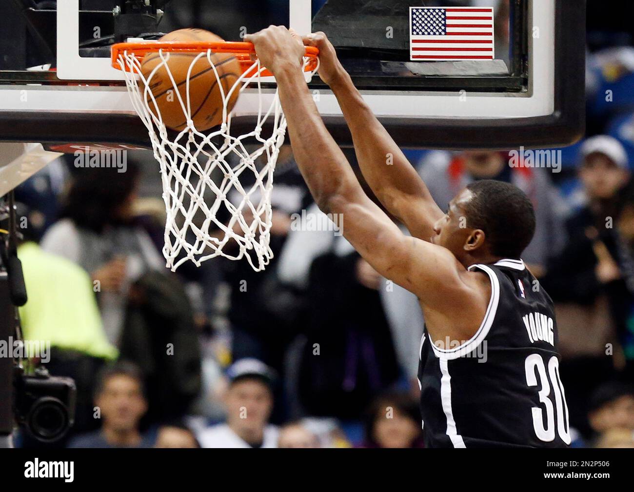 Brooklyn Nets forward Thaddeus Young dunks in the first quarter of an NBA basketball game ...