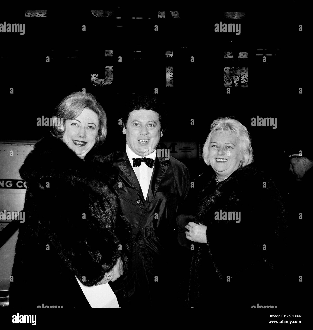 Comedian Marty Allen, center, arrives for the premiere of "The Train ...