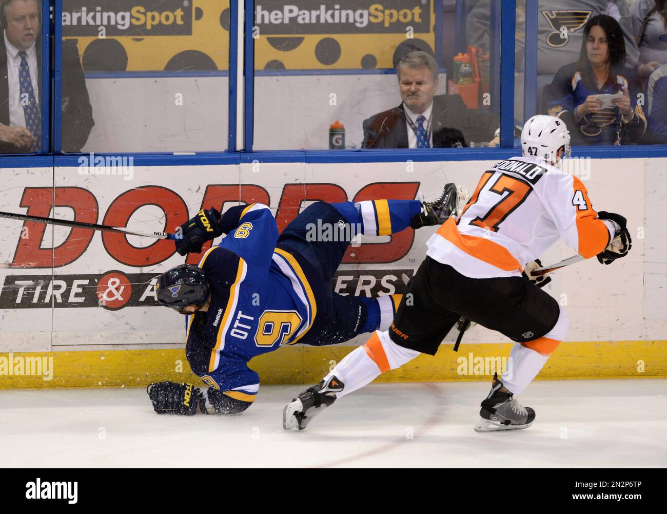 St. Louis Blues' Steve Ott (9) is checked by Philadelphia Flyers ...