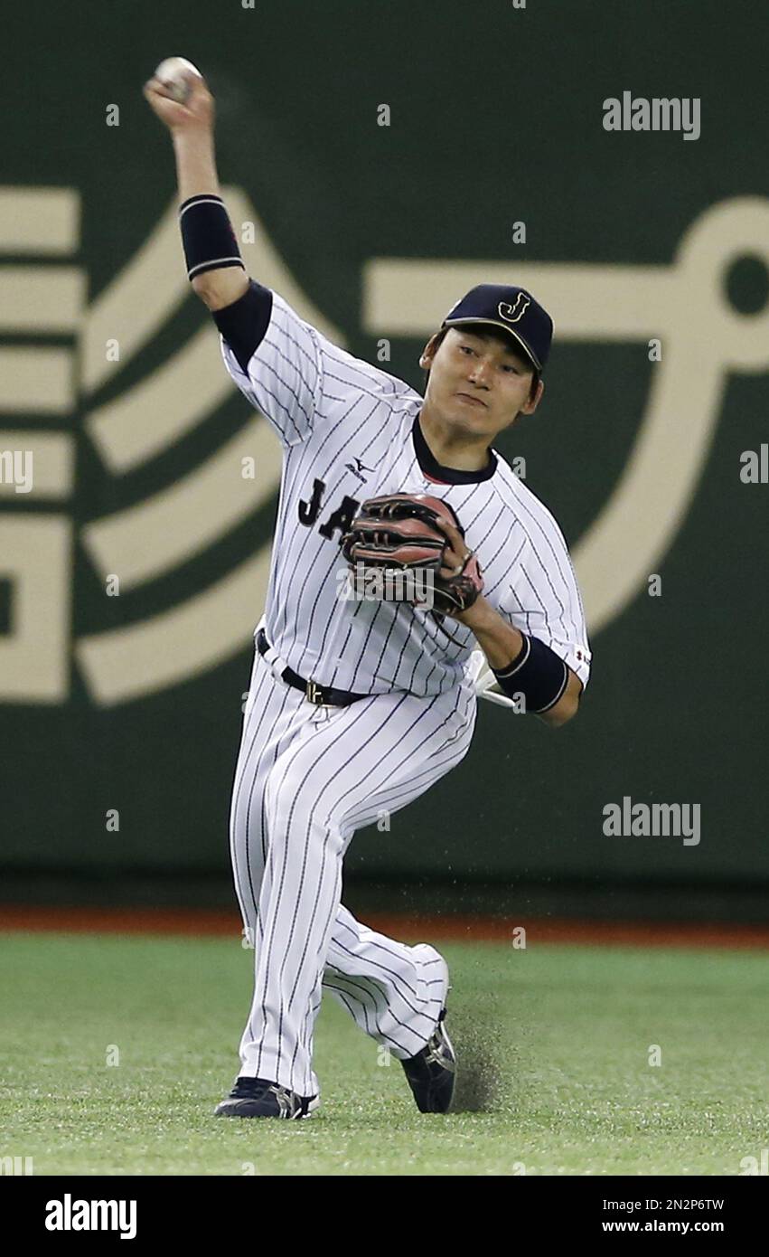 Japan’s Yoshihiro Maru throws a ball at practice of the friendly ...