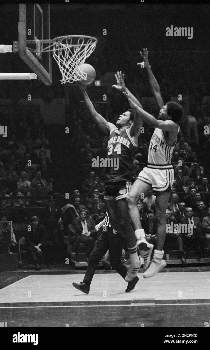 Notre Dame's Austin Carr (34), dark uniform, takes to the air and ...
