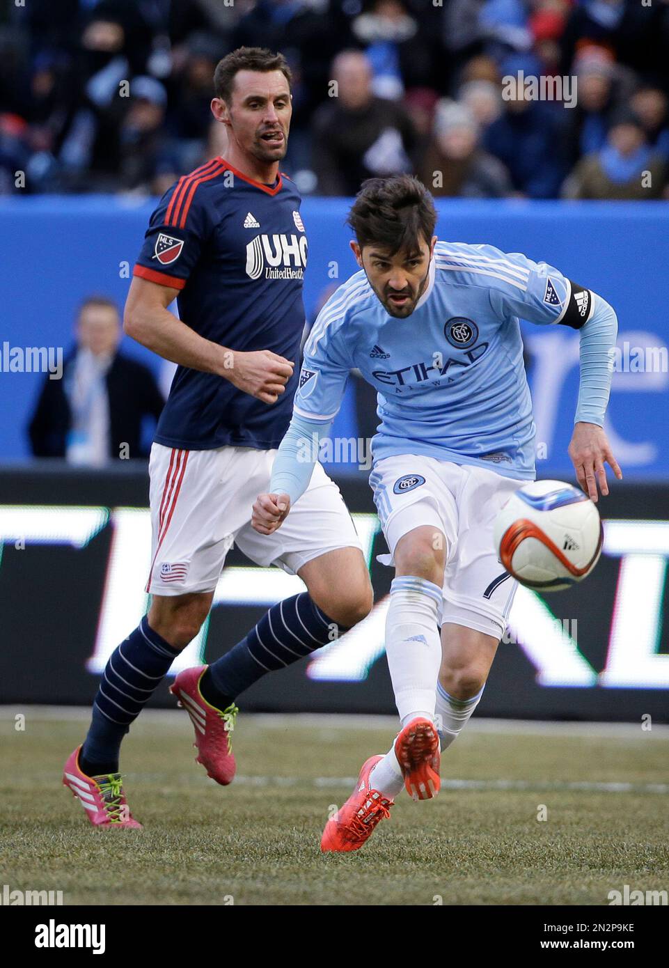 New York City FC's David Villa, right, scores while New England ...