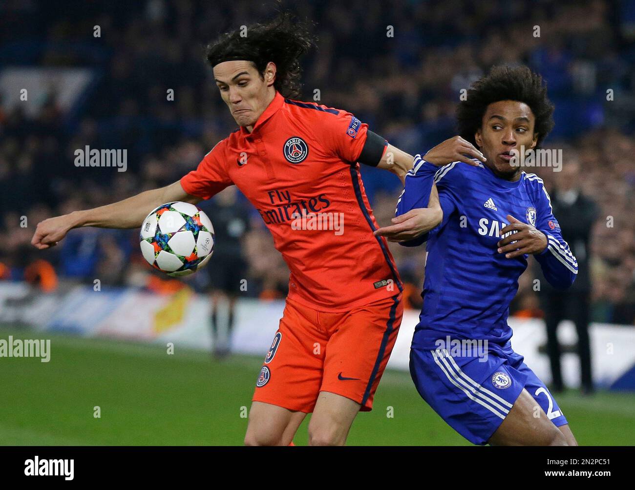 PSG's Edinson Cavani, left, challenges Chelsea's Willian during the ...