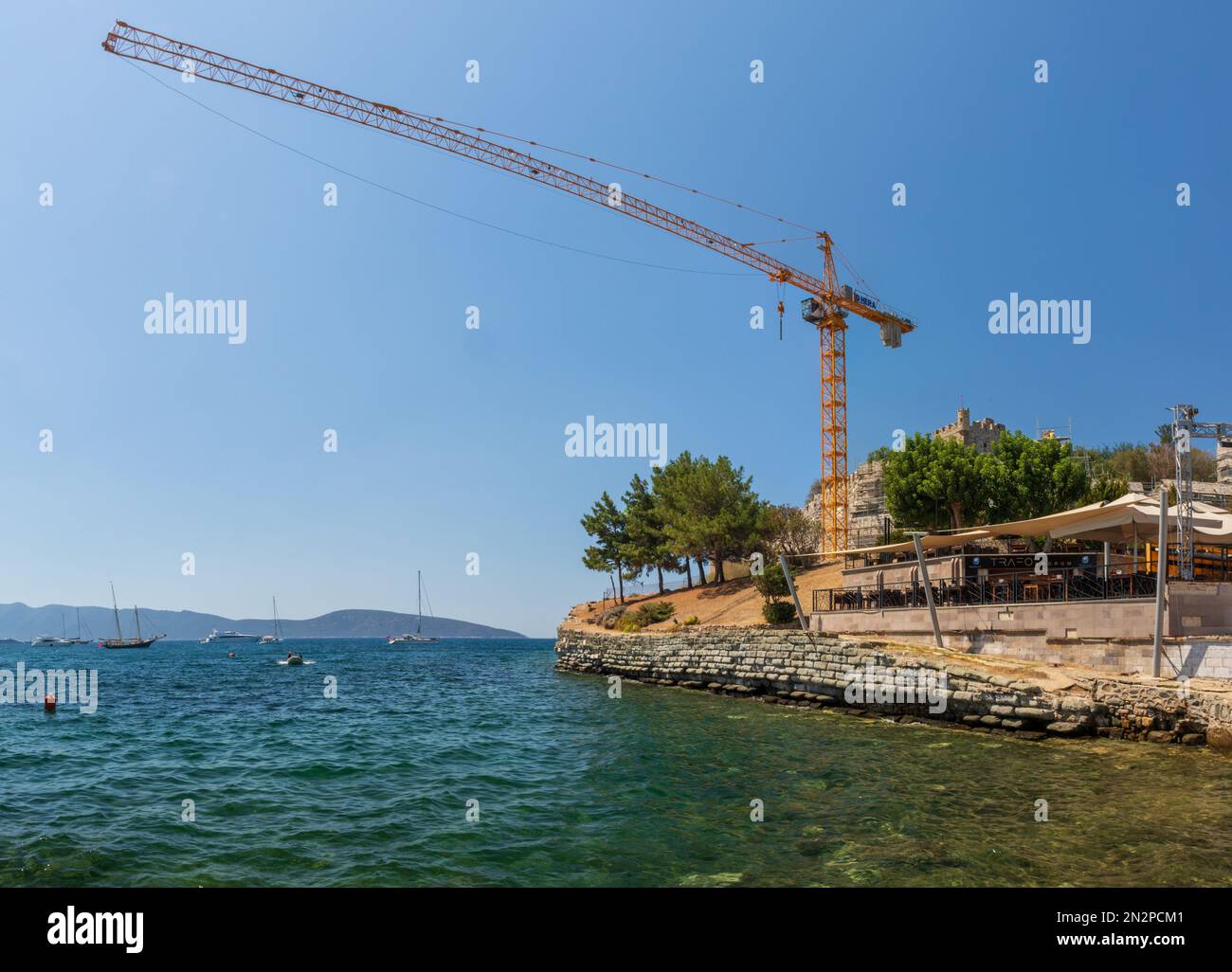 long armed crane by Bodrum castle, Turkey Stock Photo - Alamy
