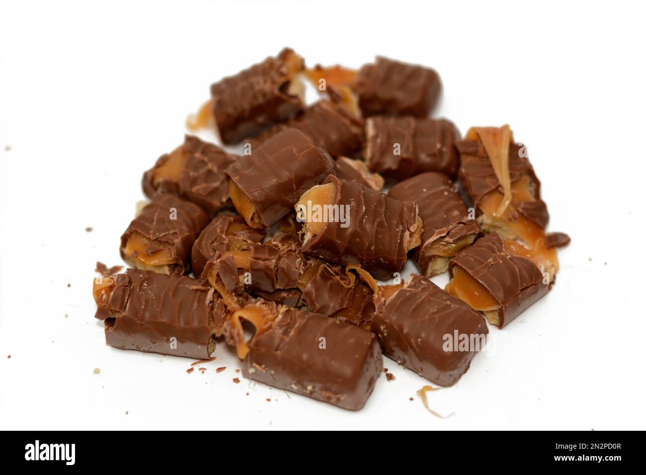 small pieces of chocolate bars sticks filled with biscuits, caramel and ...