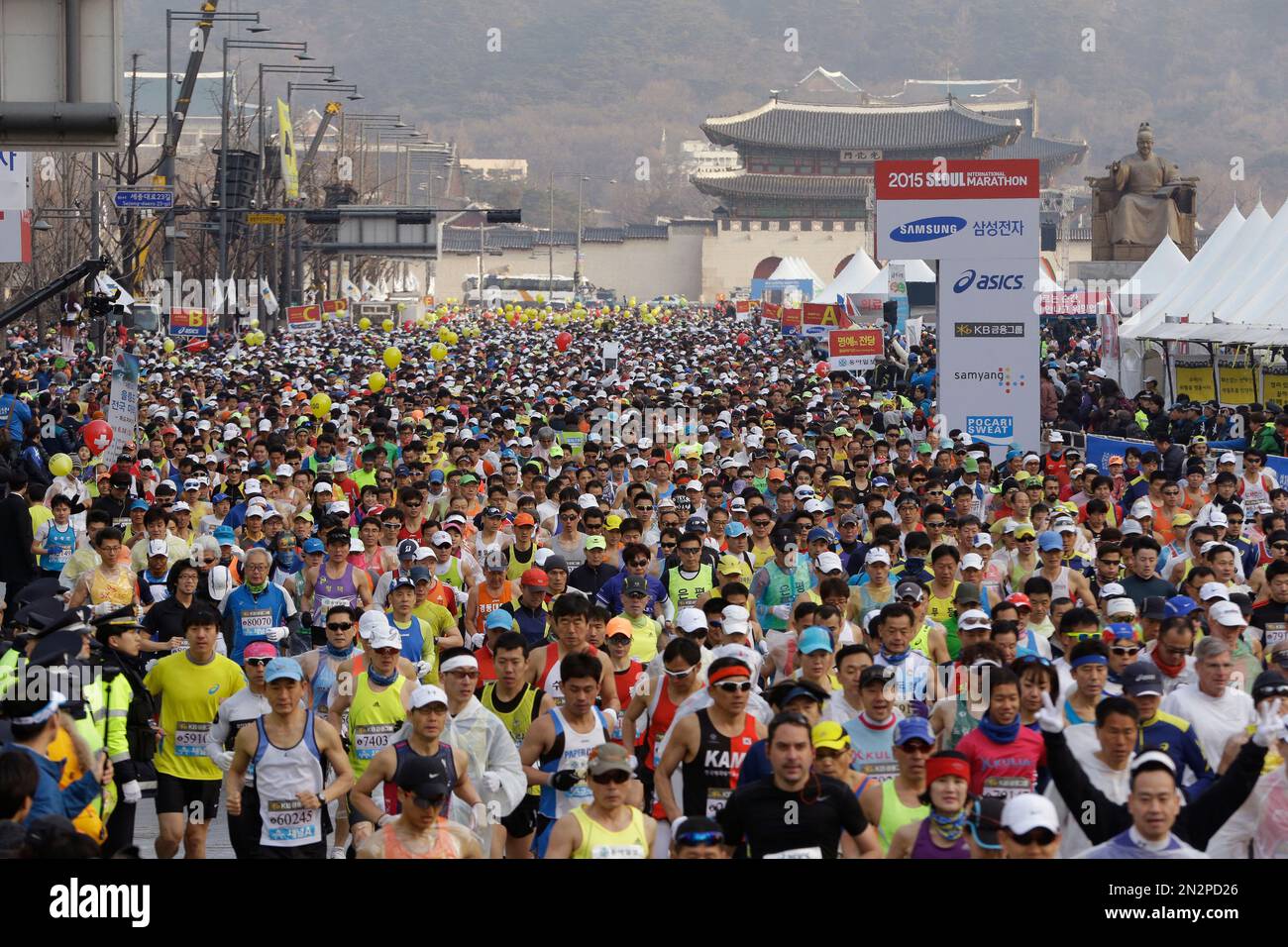 A crowd of marathoners race during the Seoul International Marathon in ...