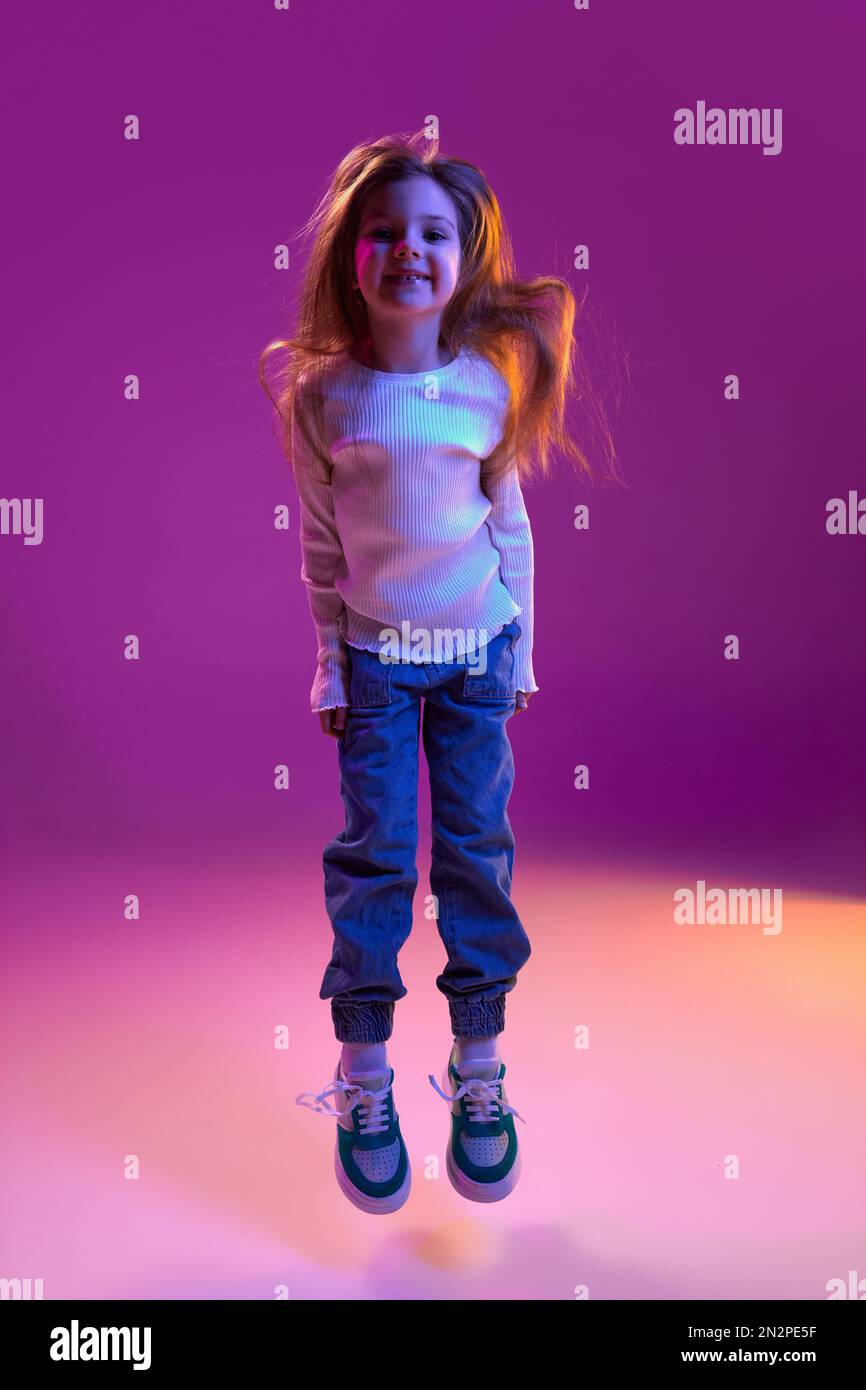 Happy, positive kid. Portrait of little girl, child in casual clothes ...