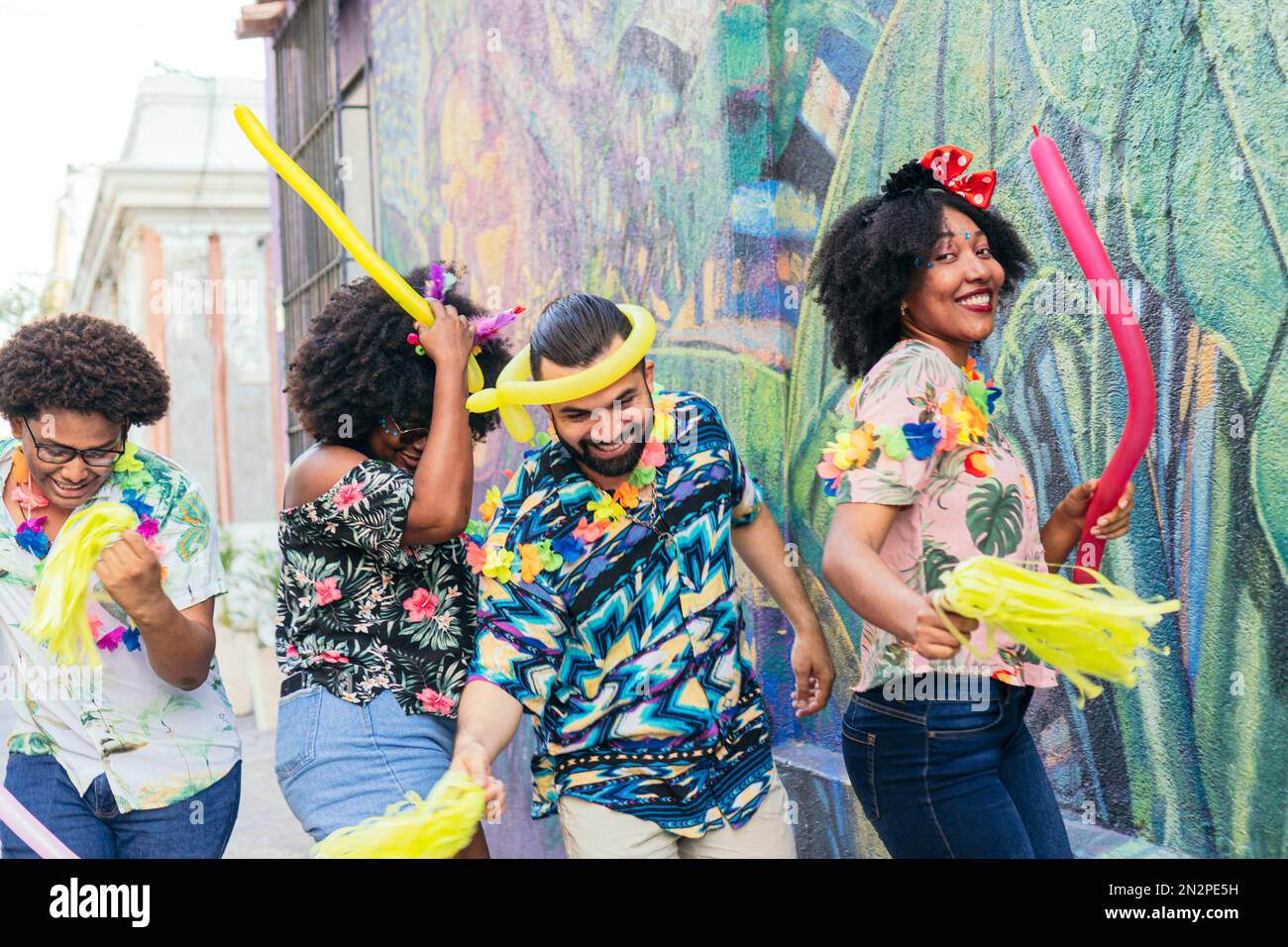Latin friends dancing in the carnival street Stock Photo - Alamy