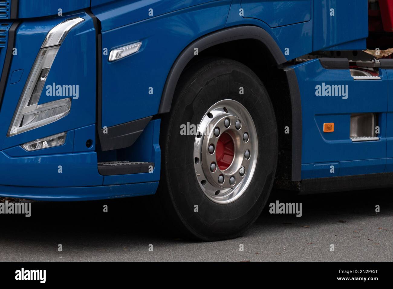 Front wheel of a blue truck. Close-up Stock Photo - Alamy