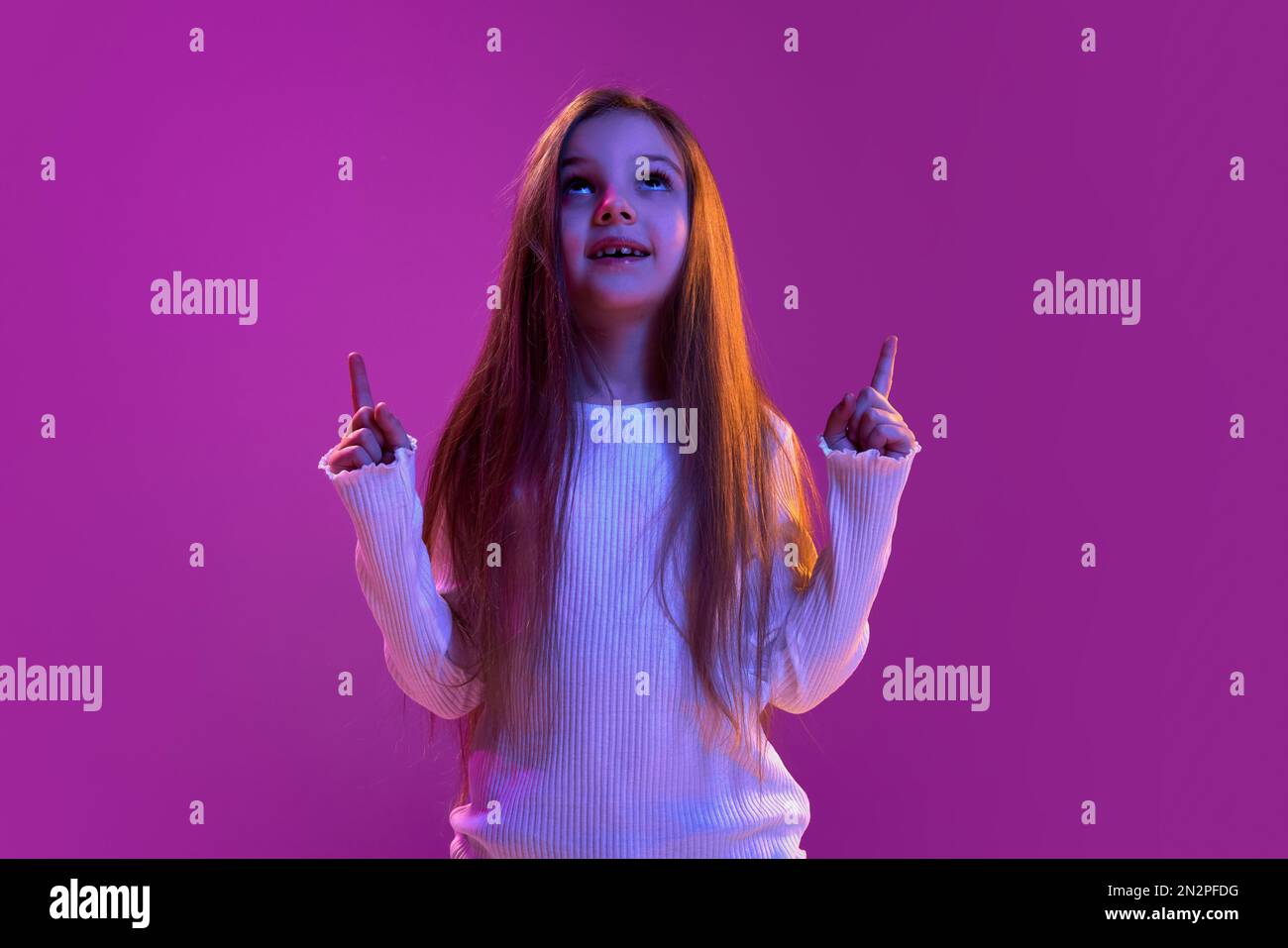 Dreaming. Portrait of little girl, child in casual clothes posing ...