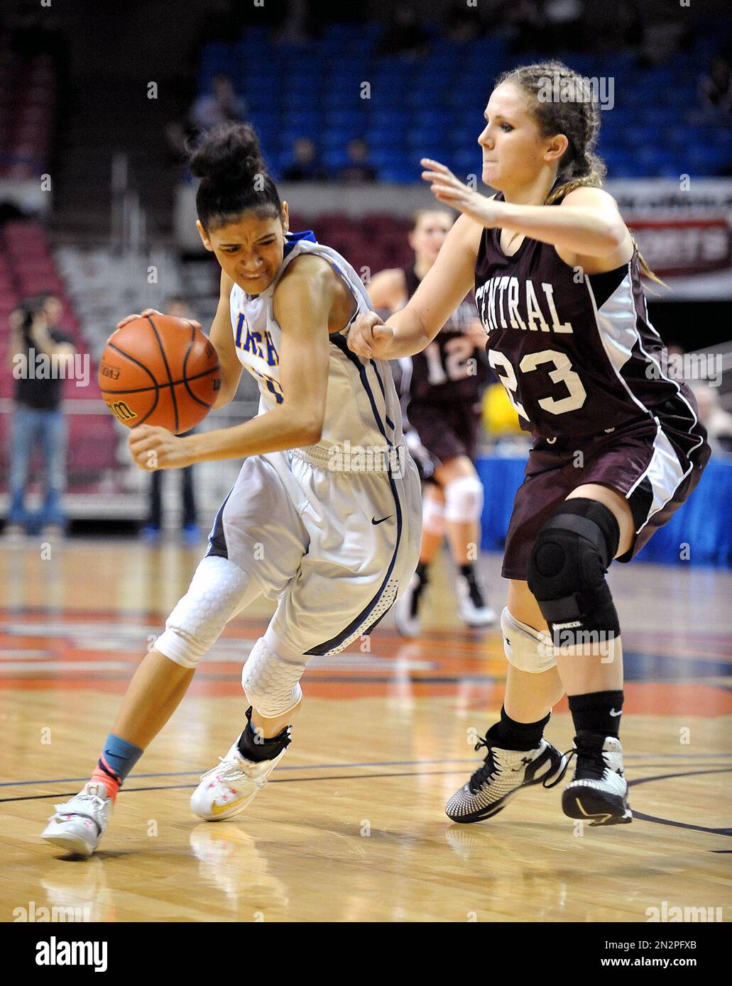 St. Joseph Central Mychelle Johnson (12) drives the lane with Wheeling ...