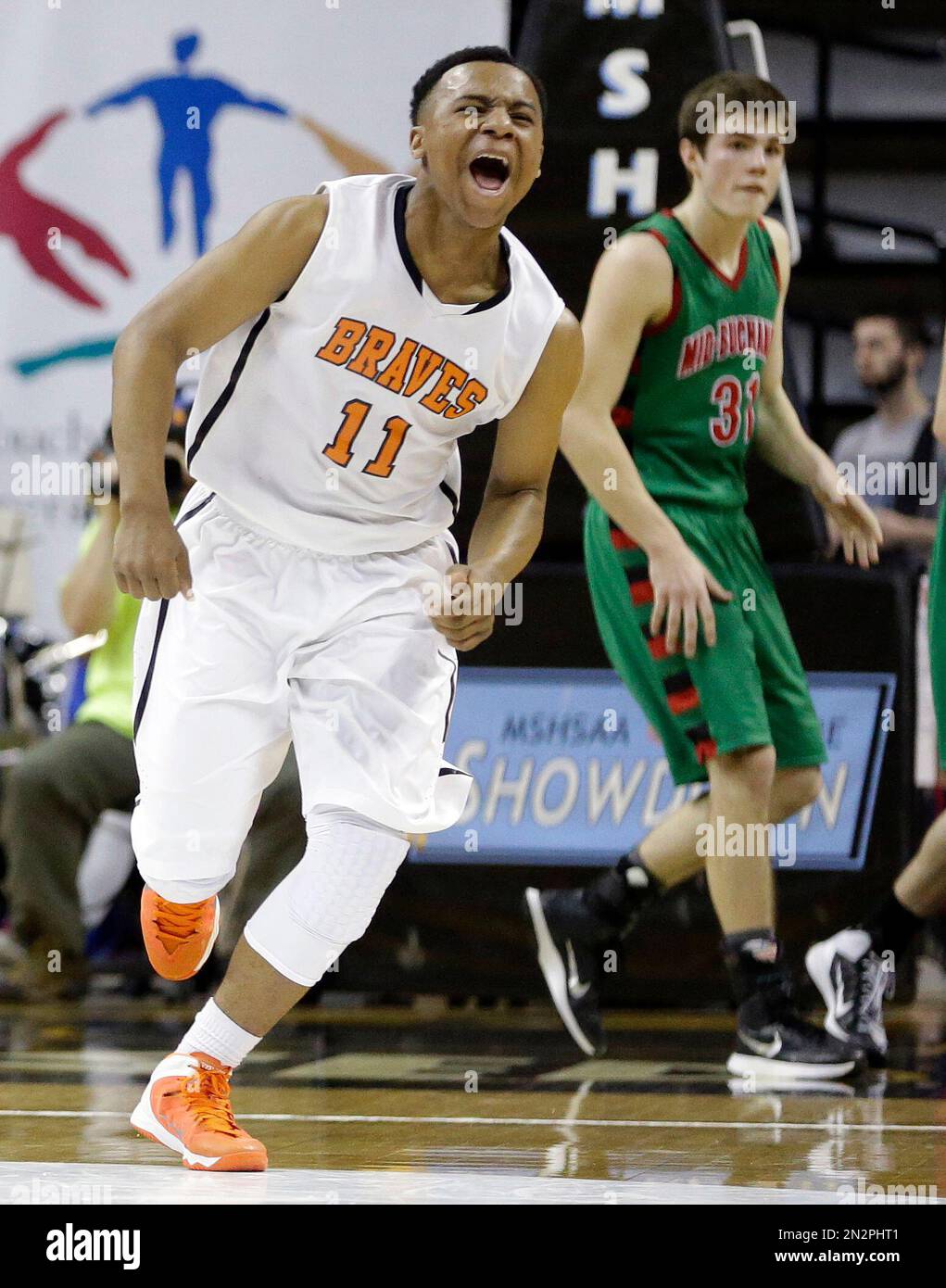 Scott County Central’s Tre Moore, left, celebrates as Mid-Buchanan’s ...