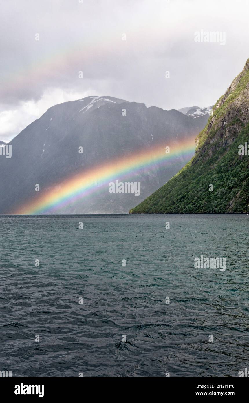 Beautiful rainbow over Geirangerfjord, located near the Geiranger ...