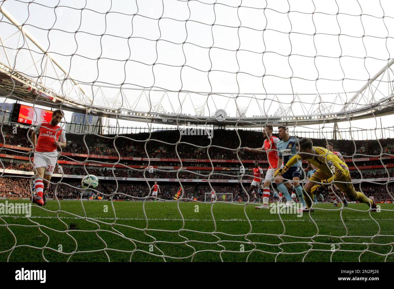 Arsenal's Mathieu Flamini, left, scores his side's third goal during ...